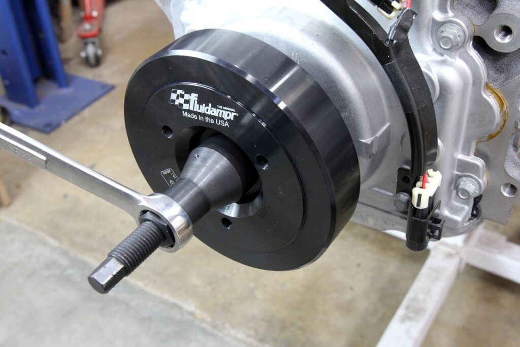 Installation process of a Concept One pulley system on a LS3 engine.