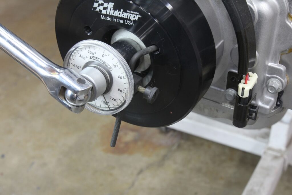 Installation process of a Concept One pulley system on a LS3 engine.